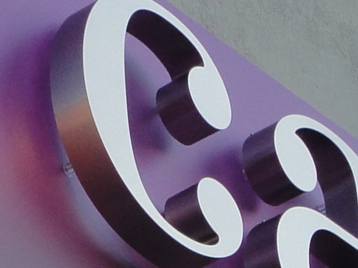 Caya Storefront Signage - UFOs Made Here